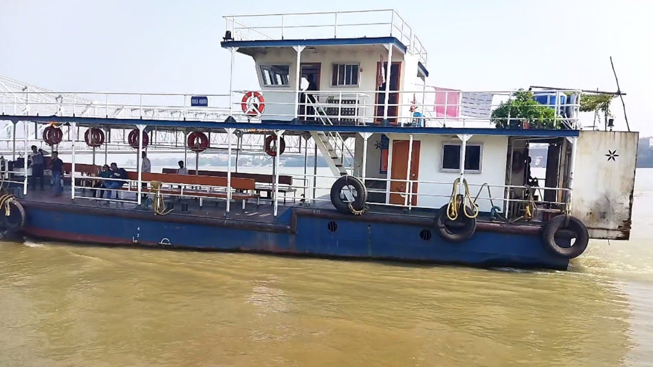 Heavy Crowded Ferry. Howrah to Kolkata. Hooghly River. Howrah Bridge ...