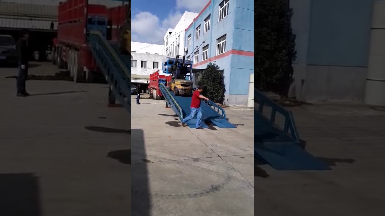 loading goods to lorry by mobile loading ramp - YouTube