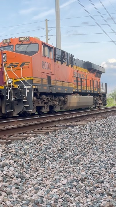 Spotted BNSF 8000 leading M-CSYHOU with a HLCX trio trail while heading south of BNSF Casey yard ...