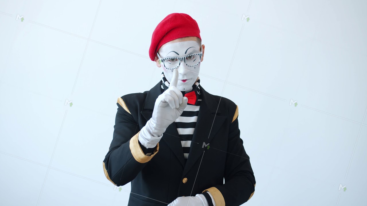 Portrait of mime shaking head then waving finger and pointing at screen ...