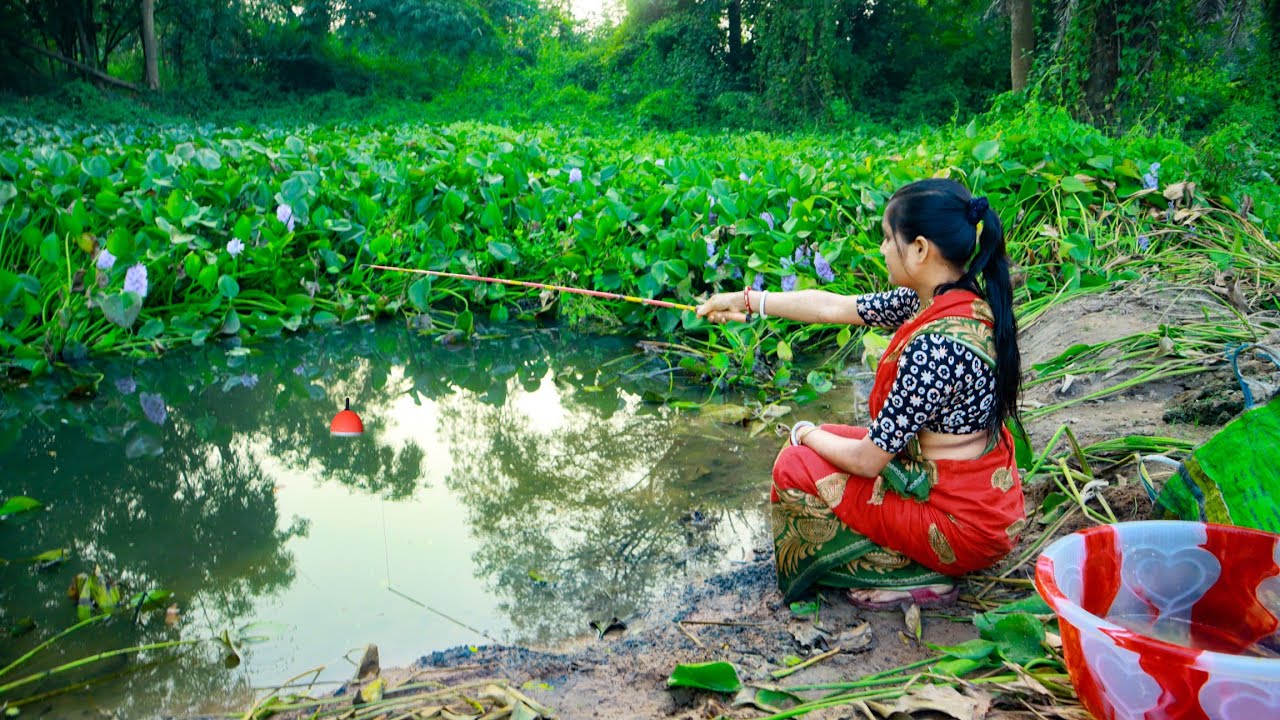 Fishing video || The brave village girl is fishing with a hook in a ...