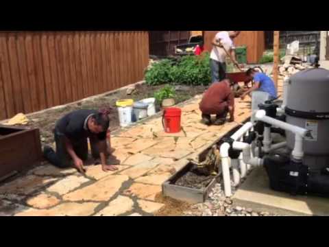Finishing stone work in backyard garden - YouTube