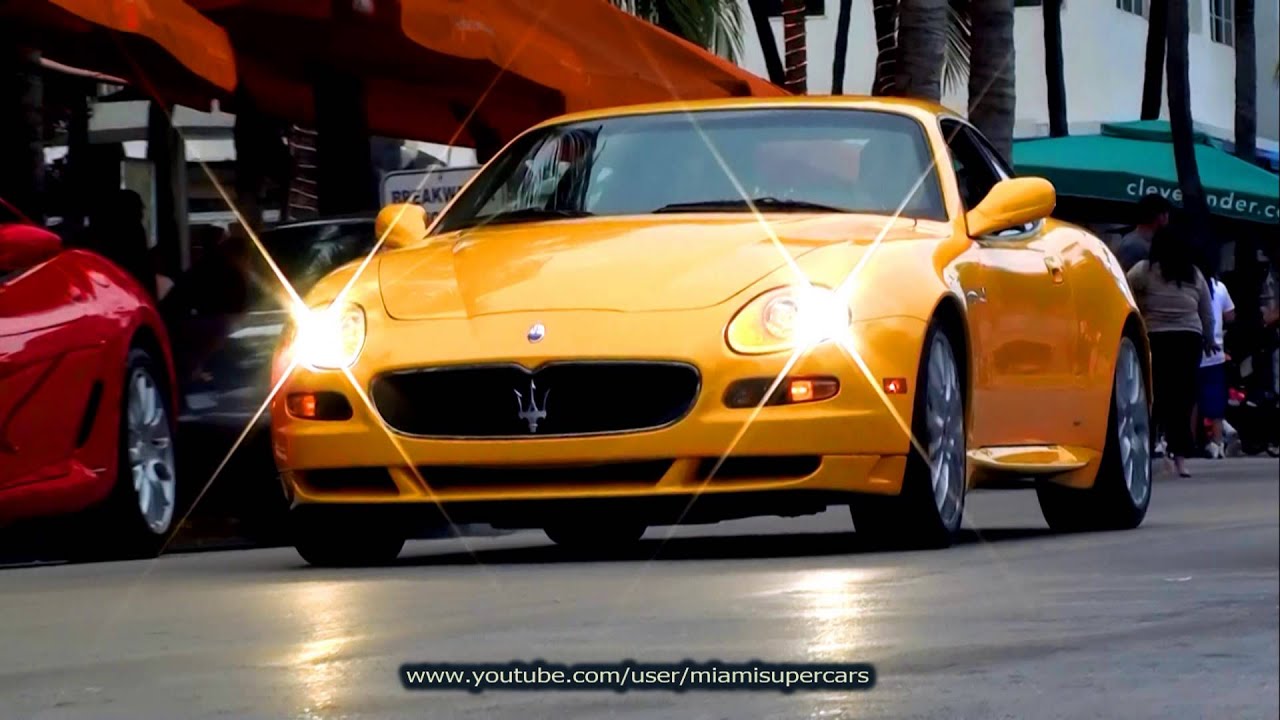 Yellow Maserati Coupe driving on Ocean Drive in Miami Beach Florida ...