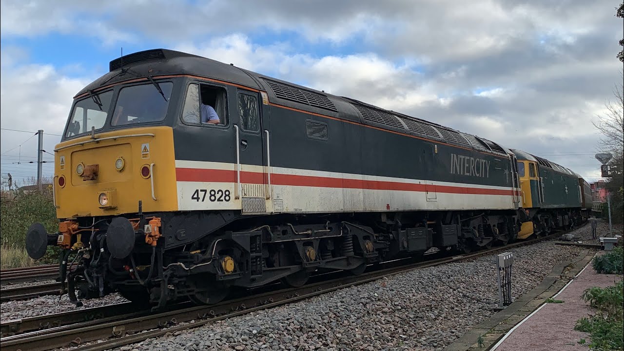 LSL Class 47828 + 47853 passing Peterborough Nene Carriage sidings ...