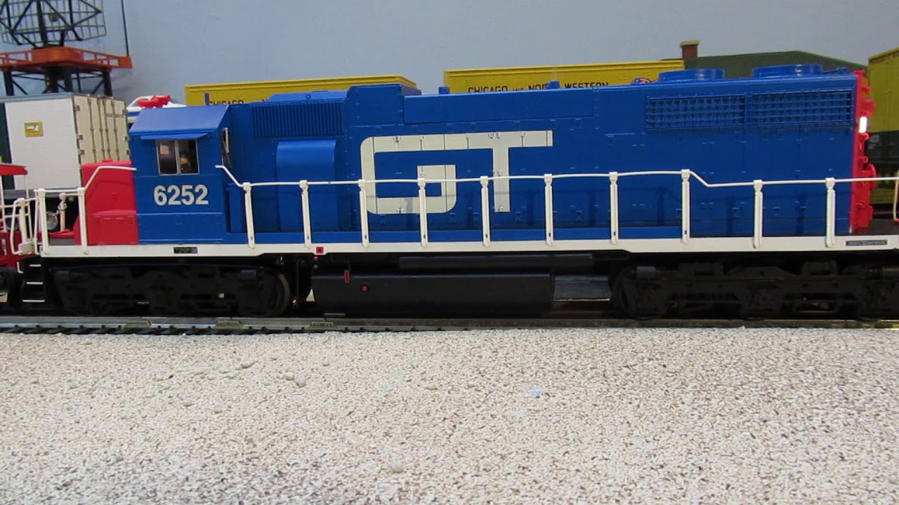 O scale GTW SD38 in forward and reverse, pushing a GTW caboose on a ...