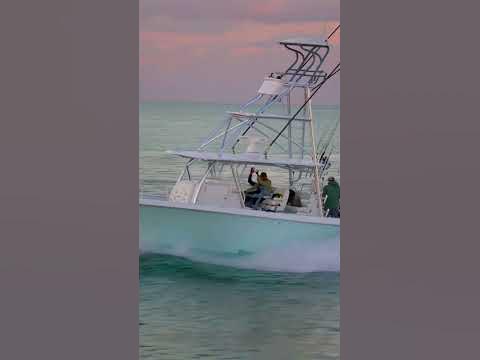 Beautiful sunset skies backdrop for this Contender center console at the Haulover Inlet in Miami ...