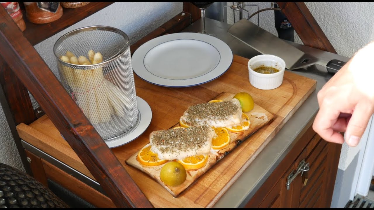 Cedar plank cod on oranges with white asparagus - Roettgen Braai Master ...