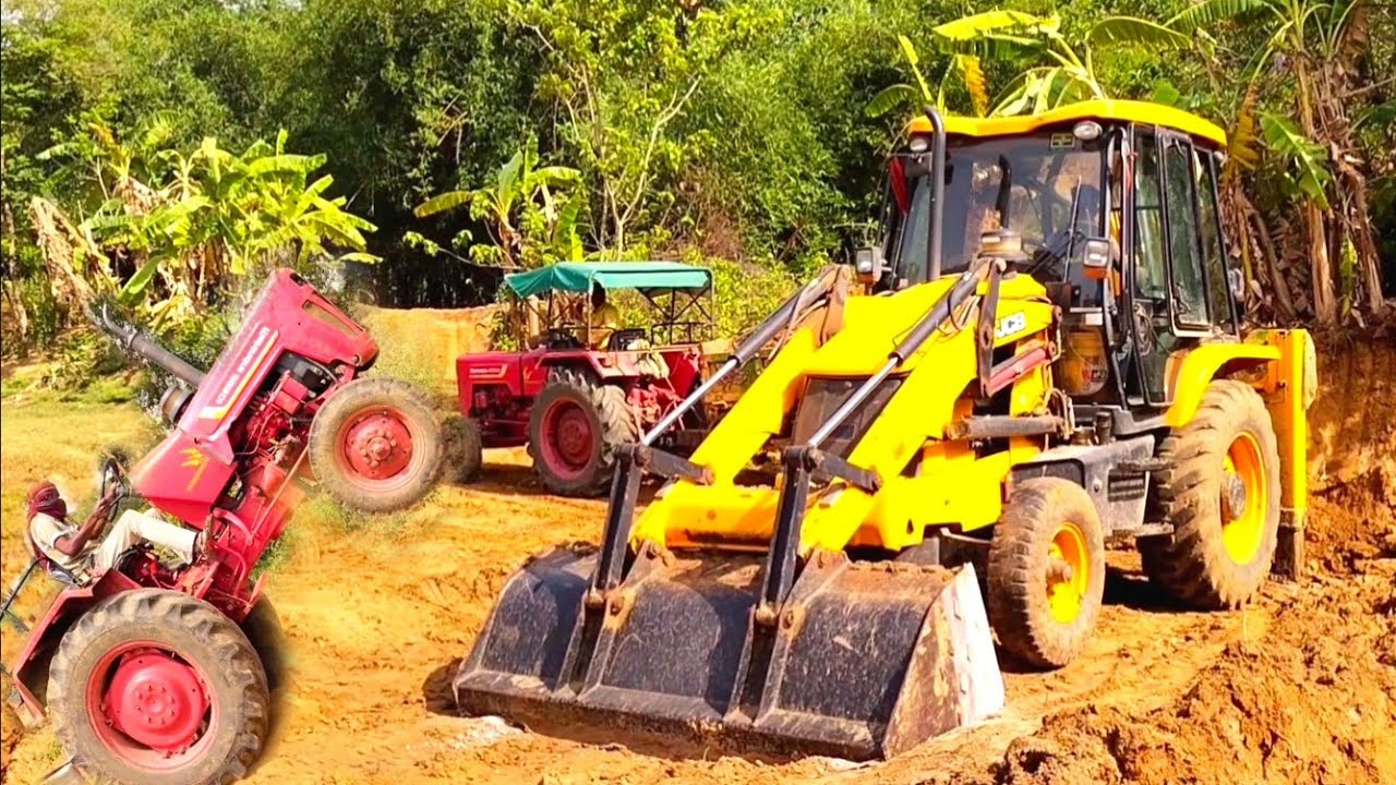Jcb 3dx Backhoe Machine Loading Mud In Old Mahindra 475 Di Tractor ...