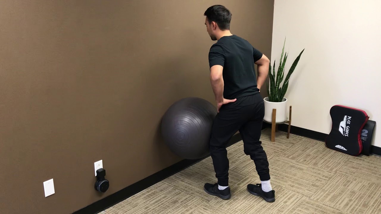 Standing knee press against wall - YouTube