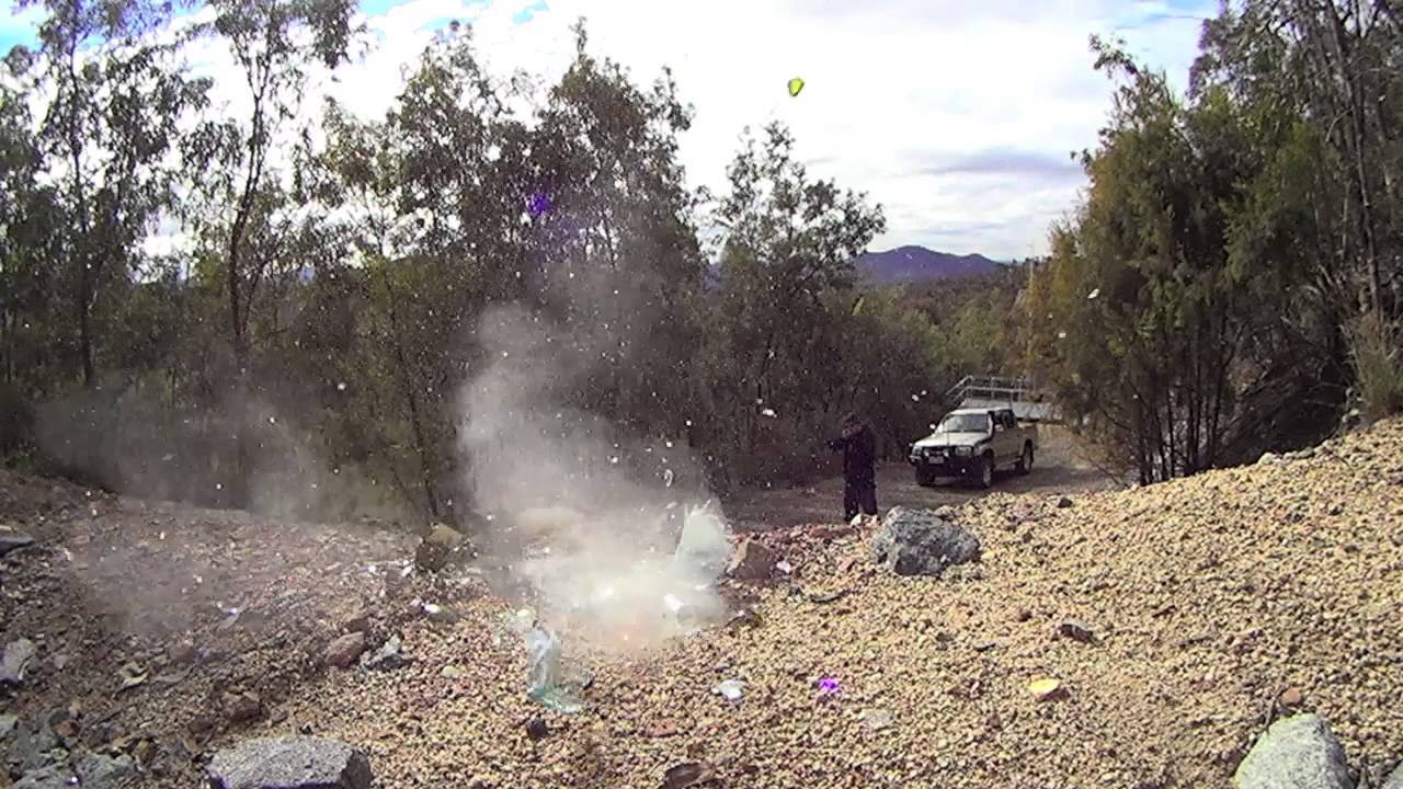 Erma werke .22lr shooting bottles slow motion - YouTube