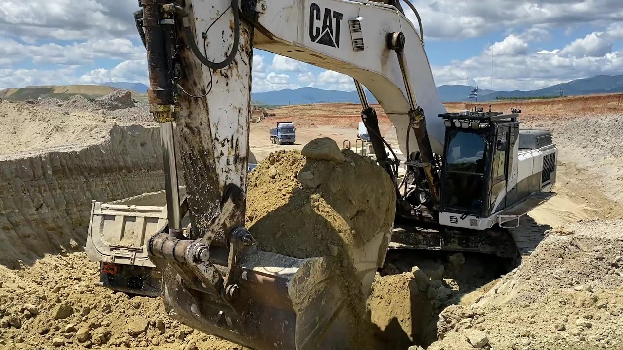 Caterpillar 375 Excavator Loading Mercedes & MAN Trucks - YouTube