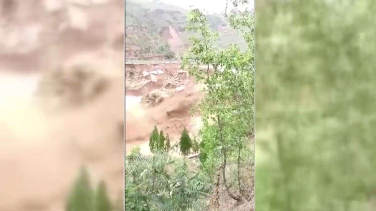Heavy rain causes dam failure in a reservoir in NW China - YouTube
