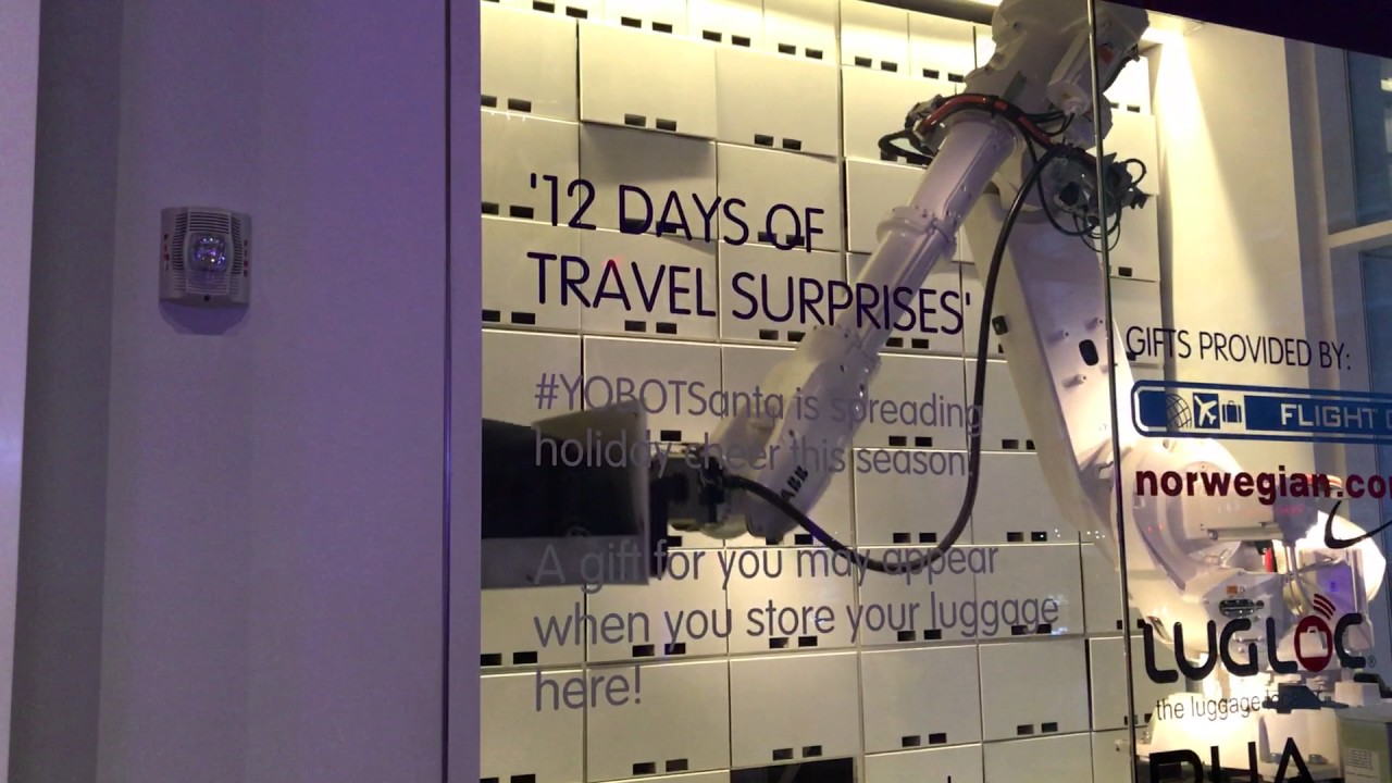 Yotel Robot returns Luggage - YouTube