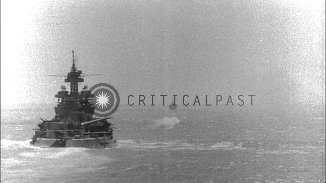 USS Maryland, BB-46, fires main battery guns and another Battleship ...