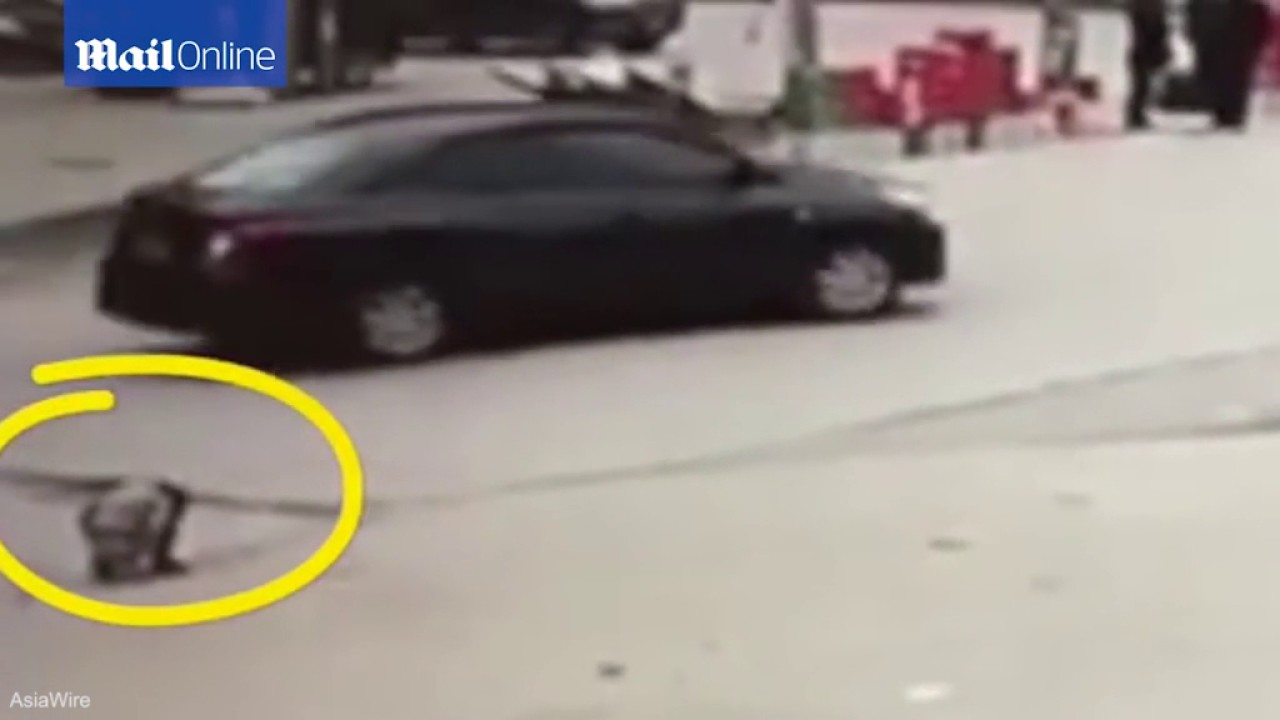 Shocking CCTV shows child run over by bus while squatting in road - YouTube