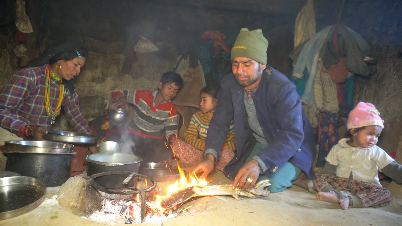 a village family in their kitchen for food all together in the village ...