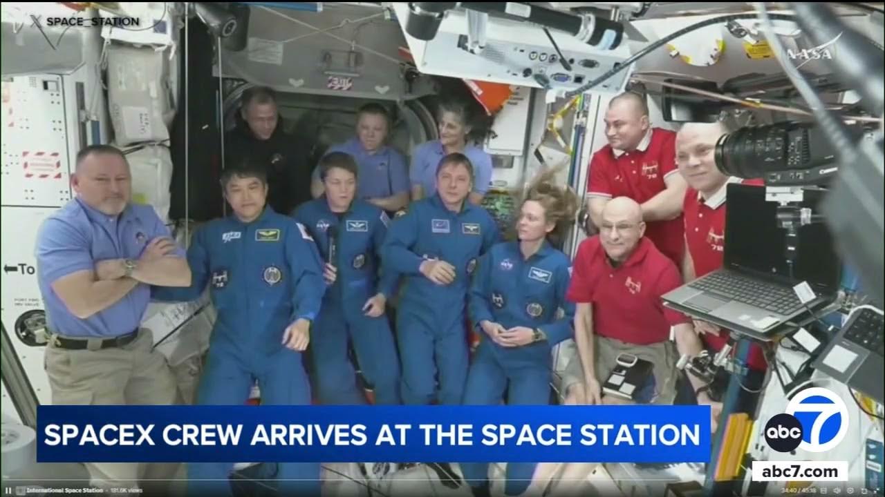 NASA's stuck astronauts welcome their newly arrived replacements to the space station - YouTube