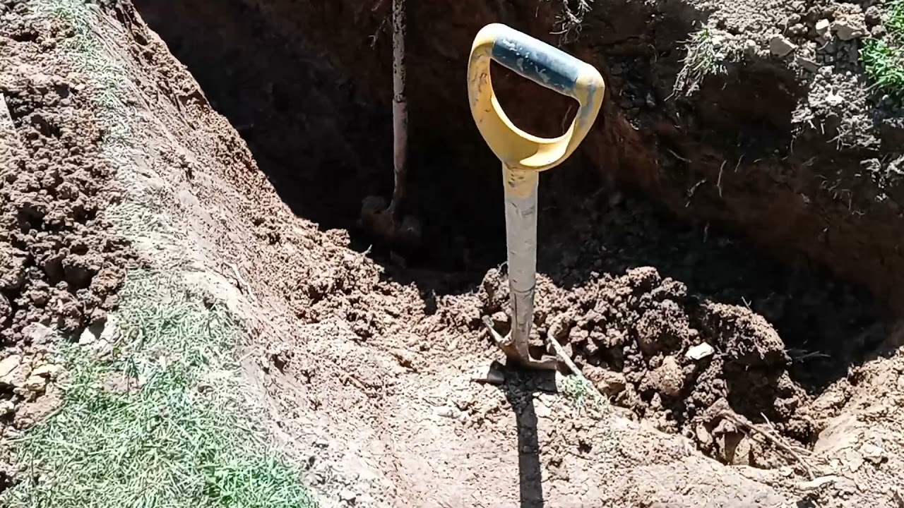 Digging up and repairing a main sewer line - YouTube