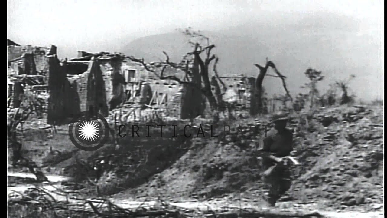 World War II. Ruins and wrecked buildings, and troops marching on a ...