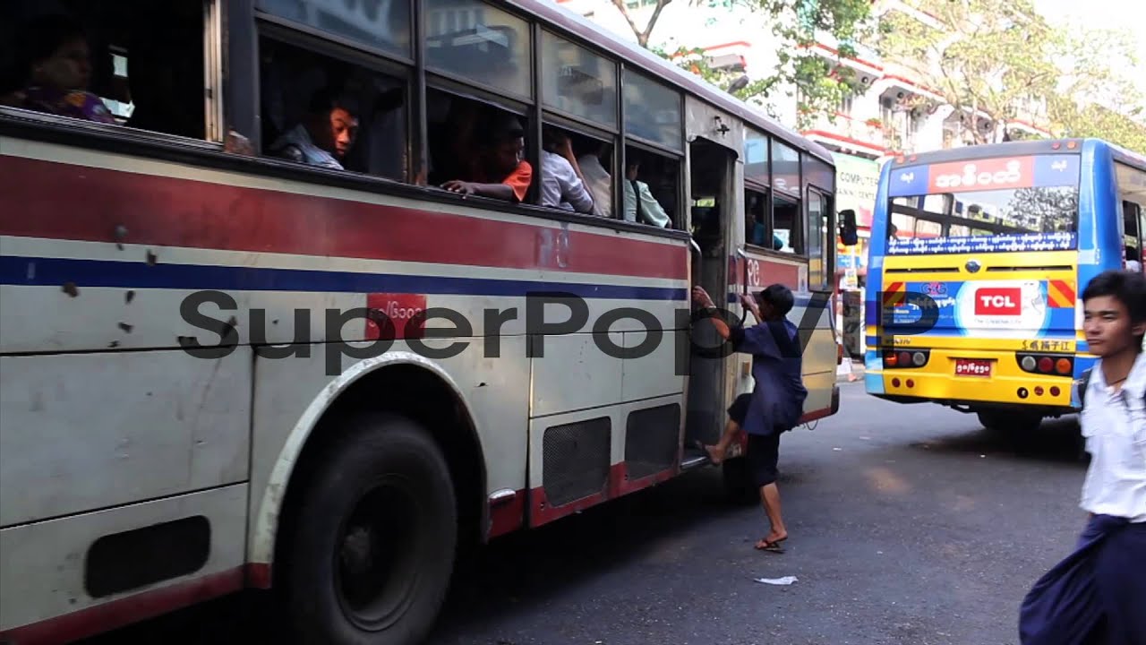 People board buses at a downtown bus station on February ... - YouTube