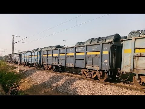 Rail Freight Train Running With Fully Loaded Steel Products Like Coils ...