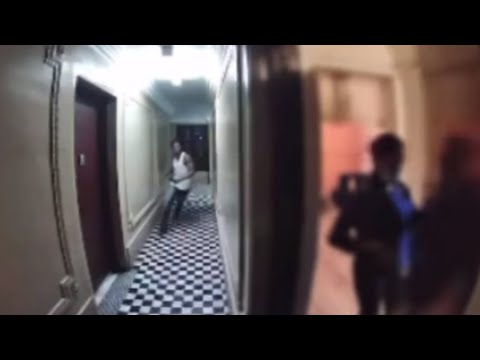 Frightening video shows man run down hallway toward woman's apartment ...
