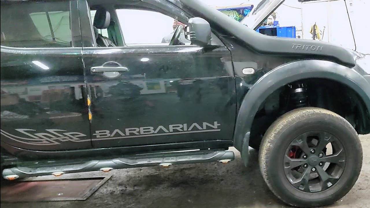 Mitsubishi L200 Front suspension spacer Lift DIY and first time ...