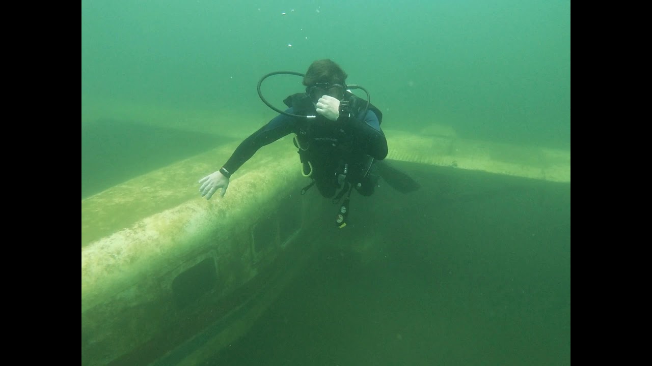 Exploring a sunken plane in a reservoir - YouTube