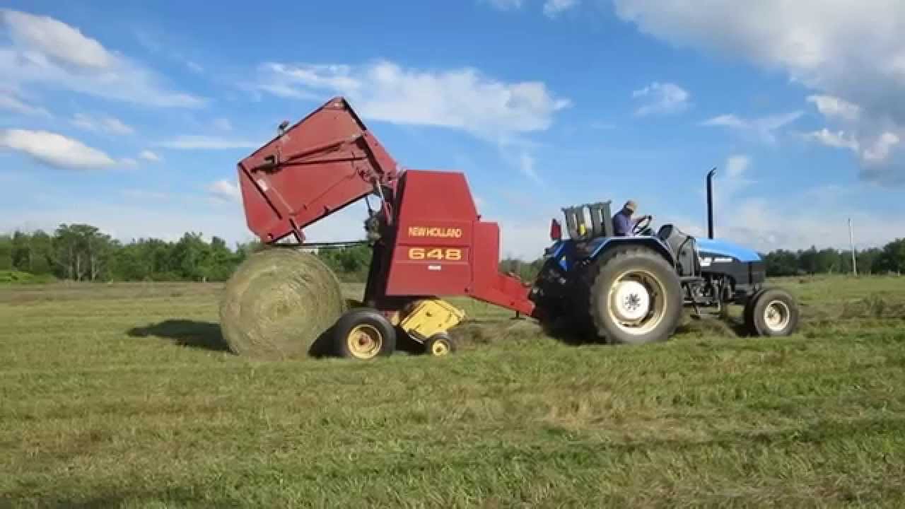 Hay baler in operation - YouTube