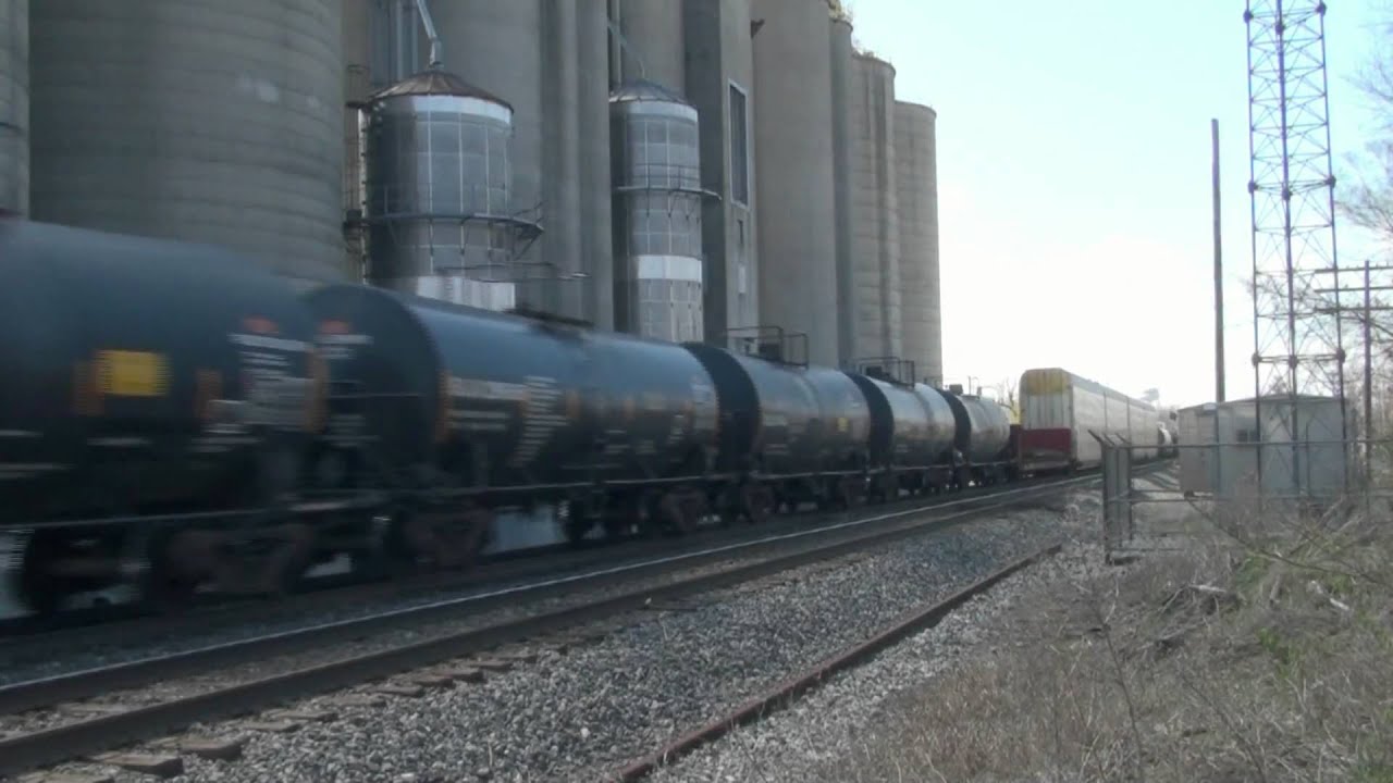 CSX FLIES PAST BNSF TRAIN 935 - YouTube