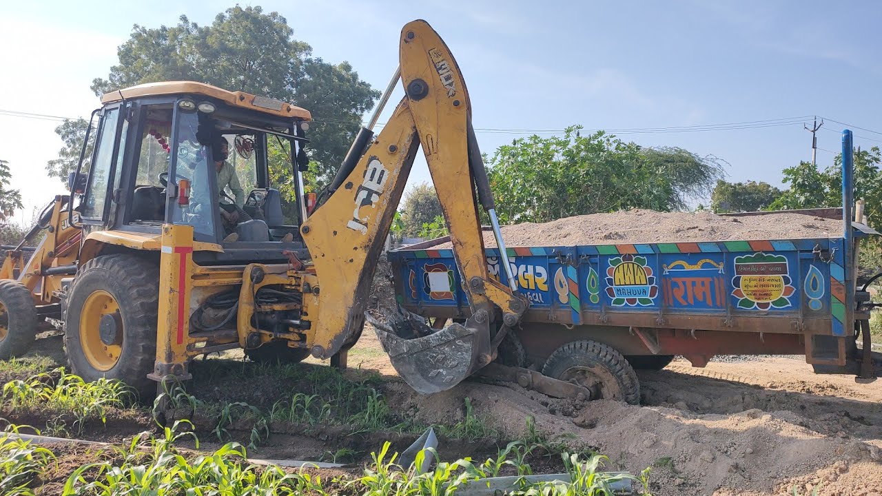 A tractor loaded with sand got stuck and was pulled out with the help ...