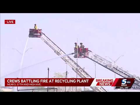 Firefighters attack flames inside OKC recycling plant from above