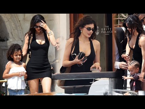 Kylie Jenner in black minidress as explores Venice with her childs Stormi and Aire onto a boat