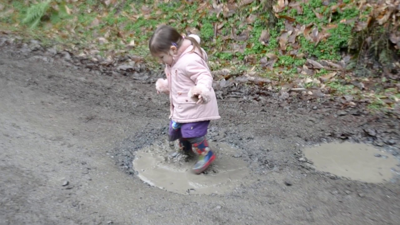 Emmeline likes jumping up and down in muddy puddles 1 - YouTube