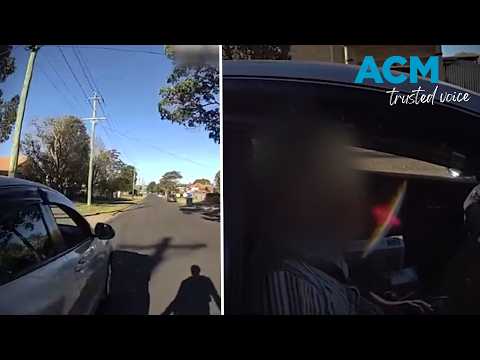 P-plater busted buttering bagel while steering with his knees in traffic