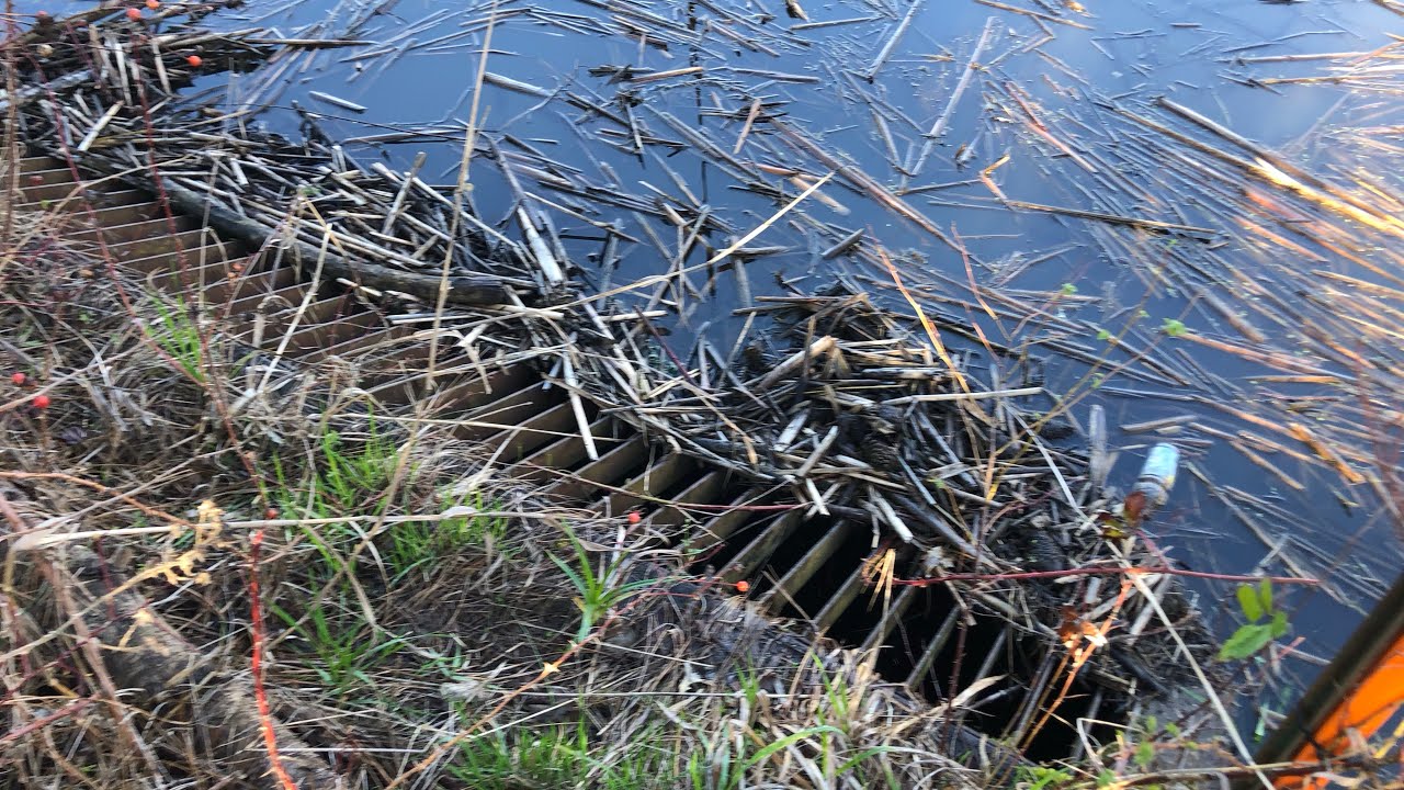 Unclogging Lake Drain - YouTube