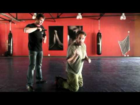 Gun disarm on knee position from the back - YouTube