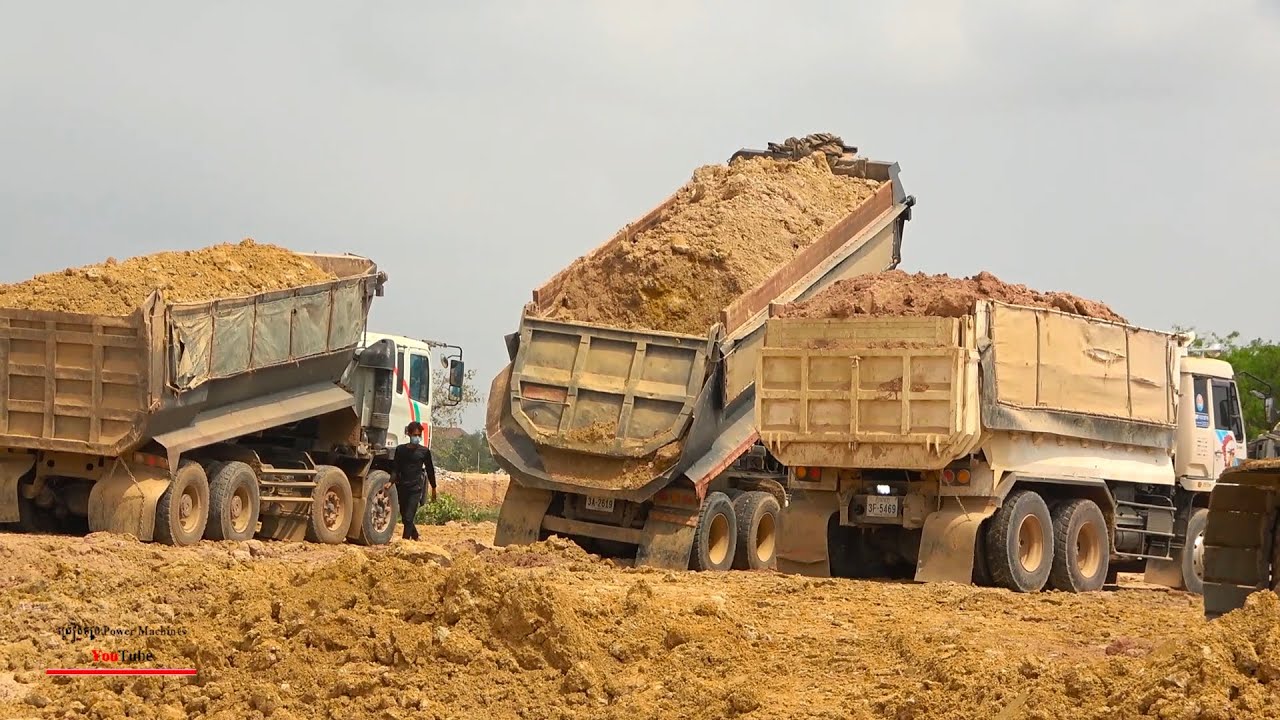 Overloaded Dump Truck Bulldozer Operator Operating Working With Dirt ...