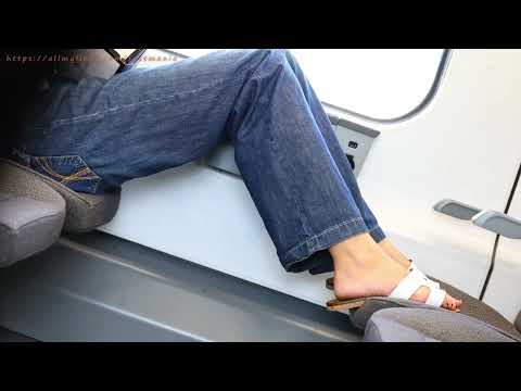 Candid beauty bratty girl with dirty slippers on seat, dangling.