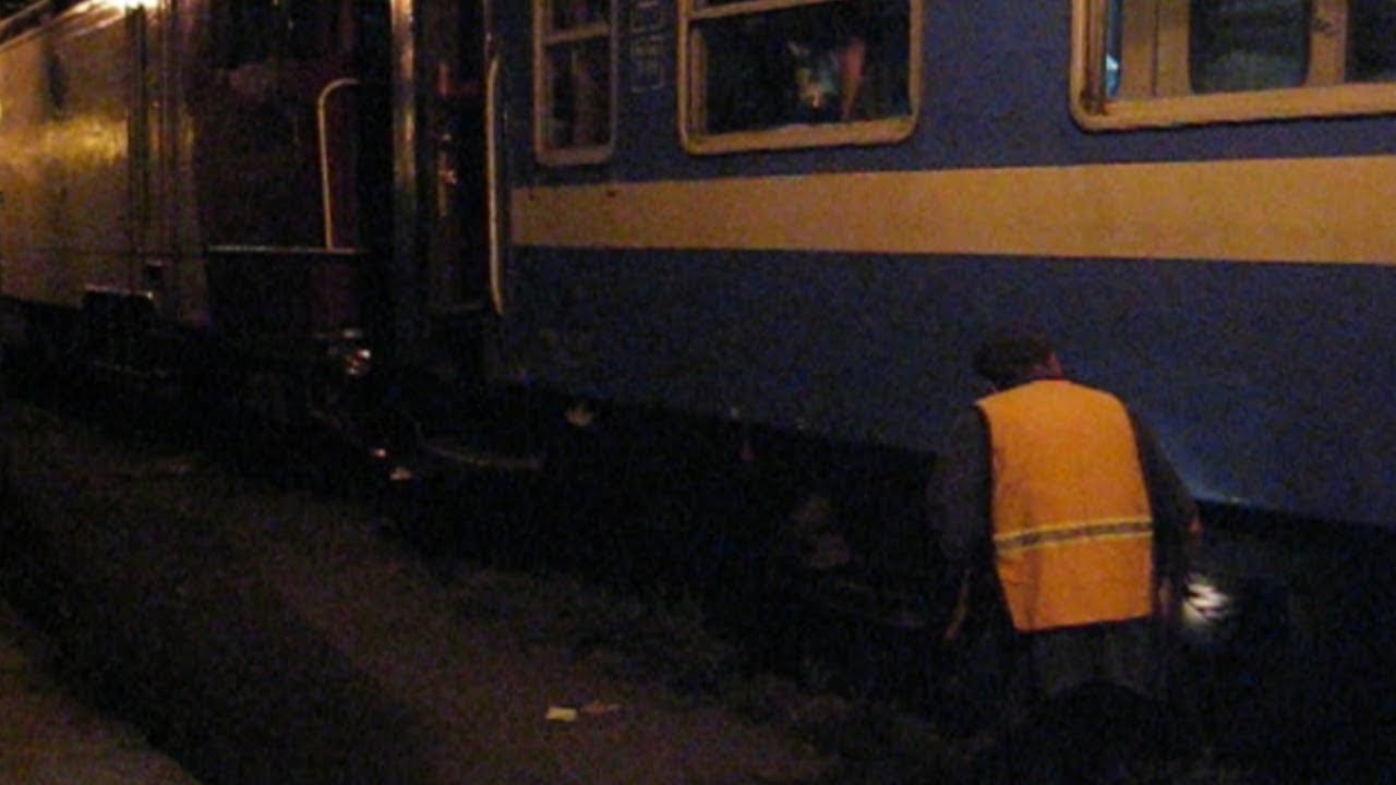 Romania: Timisoara, railway wheel tapper checking train wheels and axle ...
