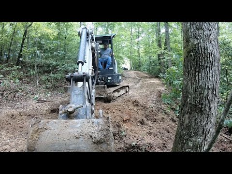 Fixing up a washed out trail Part 1 - YouTube