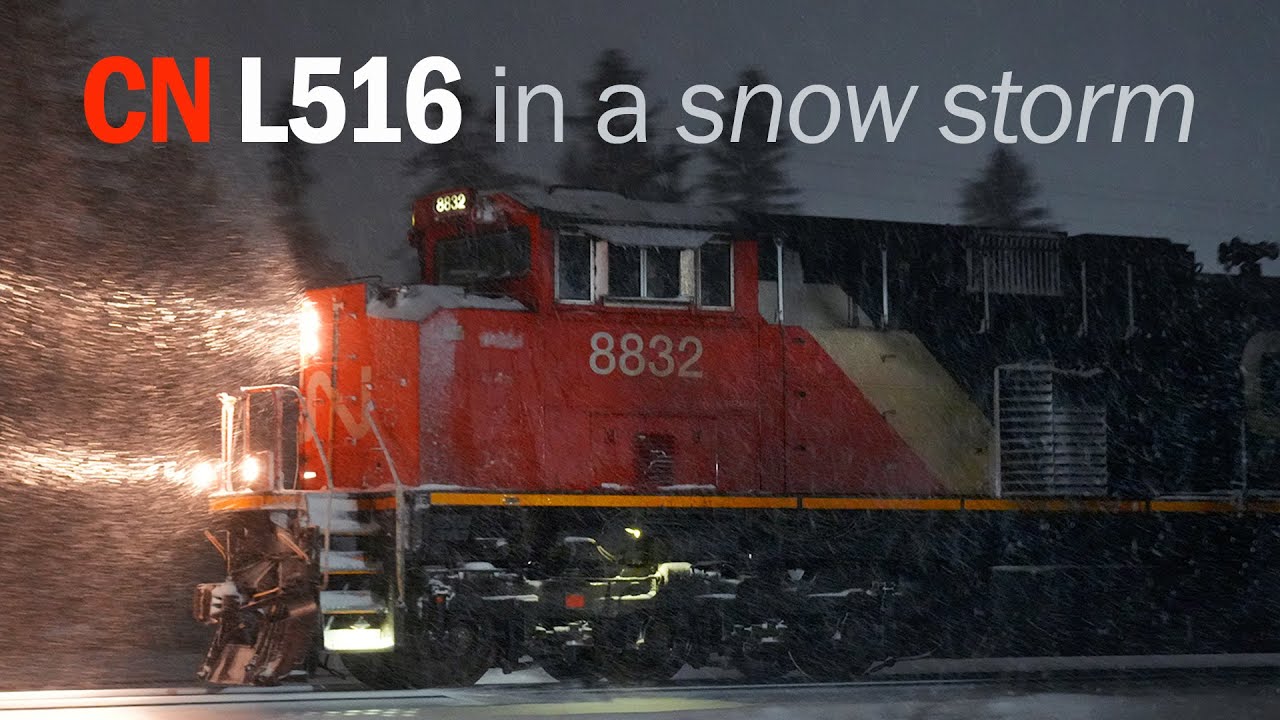 CN 8832 leads train L516 through a snow storm - YouTube