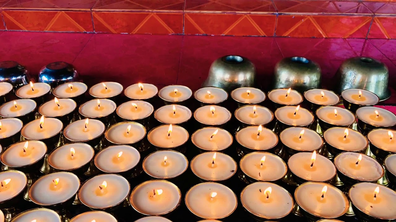 Lighting butterlamps in town monastery, mainpat - YouTube