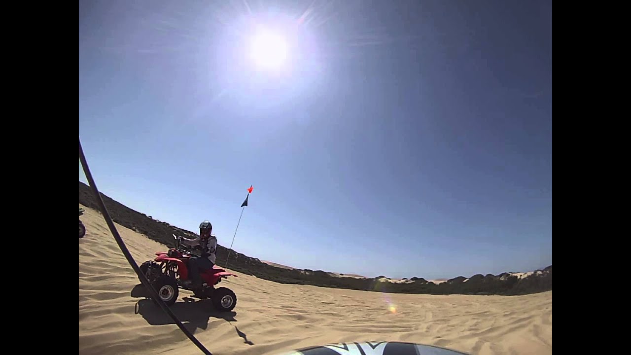 Drag racing at Pismo Dunes on the CR500 - YouTube