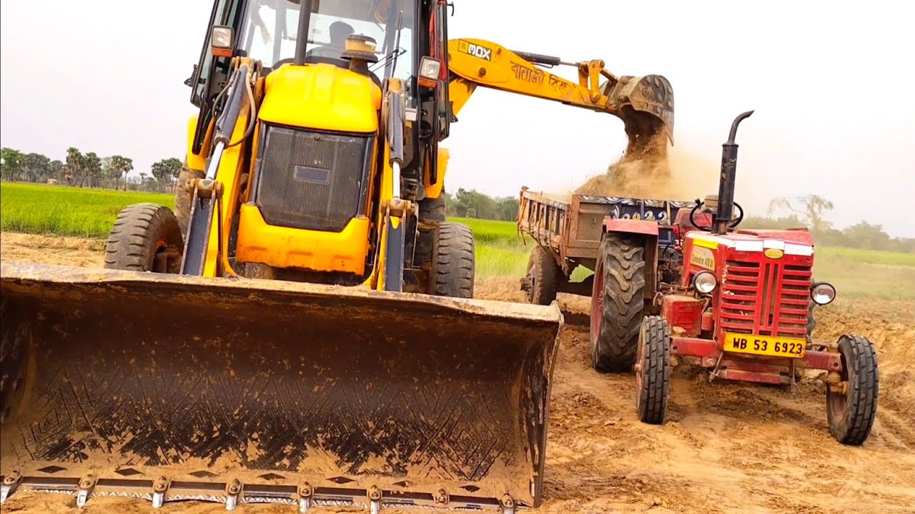 New Jcb 3dx Backhoe Machine Loading Mud In Mahindra 475 Di Tractor ...