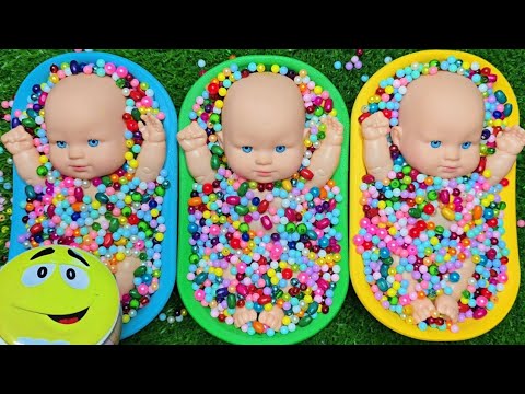 Three Cute Baby Dolls and Colorful Beads