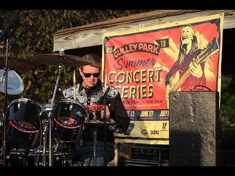 Razorback Foundation director moonlights as country music drummer - YouTube