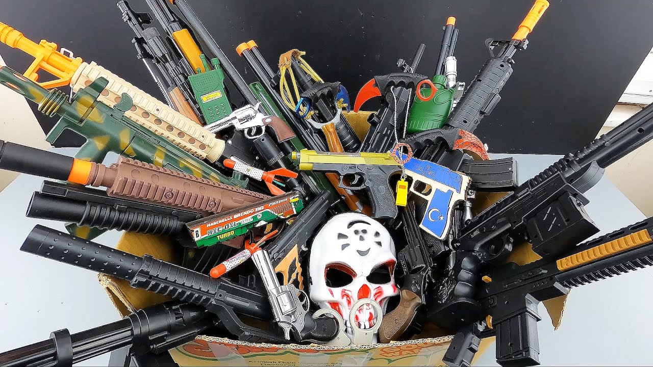Military Weapons Box of Toy Guns. Military Arsenal, Interesting Mask ...