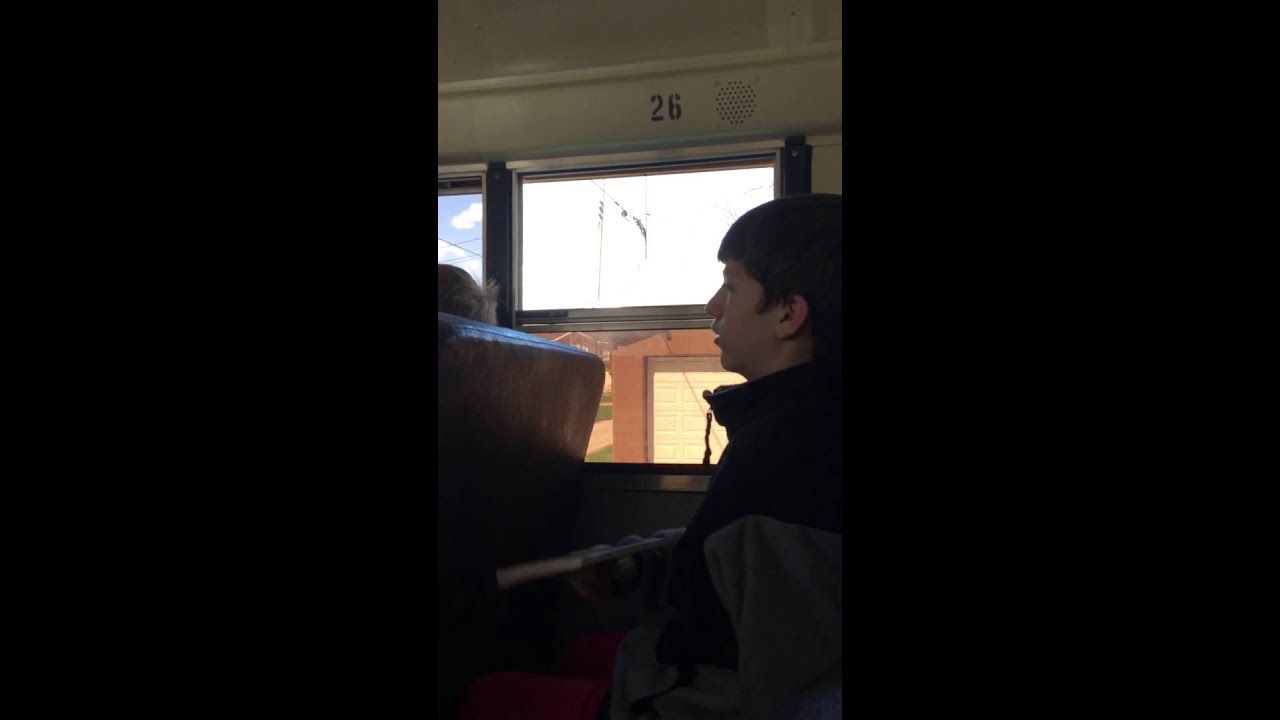 Kid throws book out bus window - YouTube