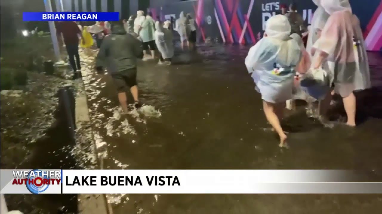 Guests waded through floodwater at Walt Disney World Resort theme parks ...